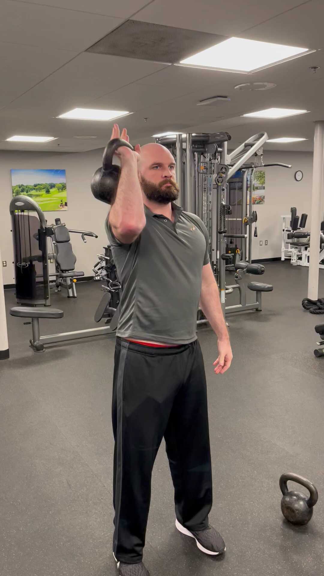 standing kettlebell overhead press (single arm)